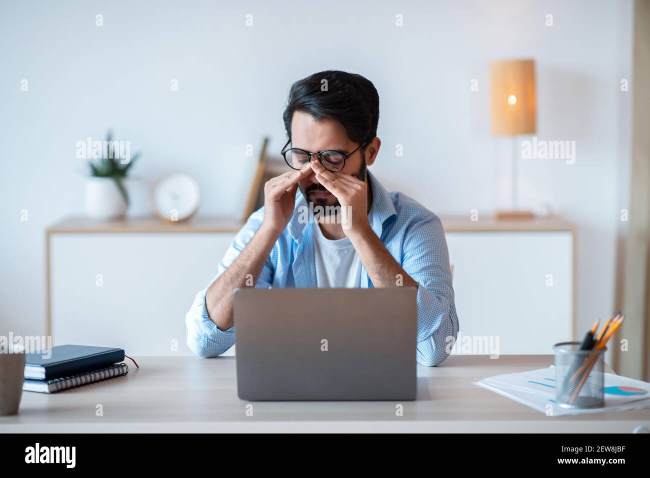 Eyes Fatigue. Arab Freelancer Man Tired After Working Remotely On Laptop Computer Stock Photo ...