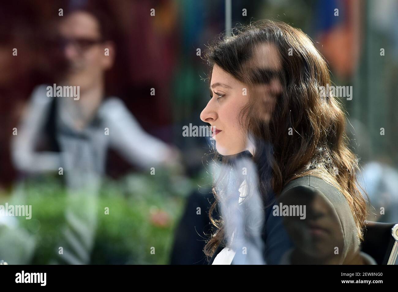 Reflection of onlookers are seen as Lauren Nash, from Philladelphia ...