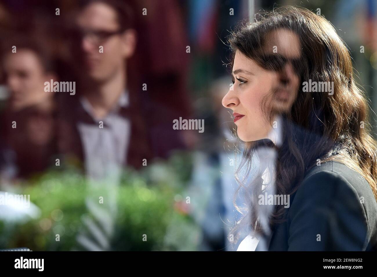 Reflection of onlookers are seen as Lauren Nash, from Philladelphia ...