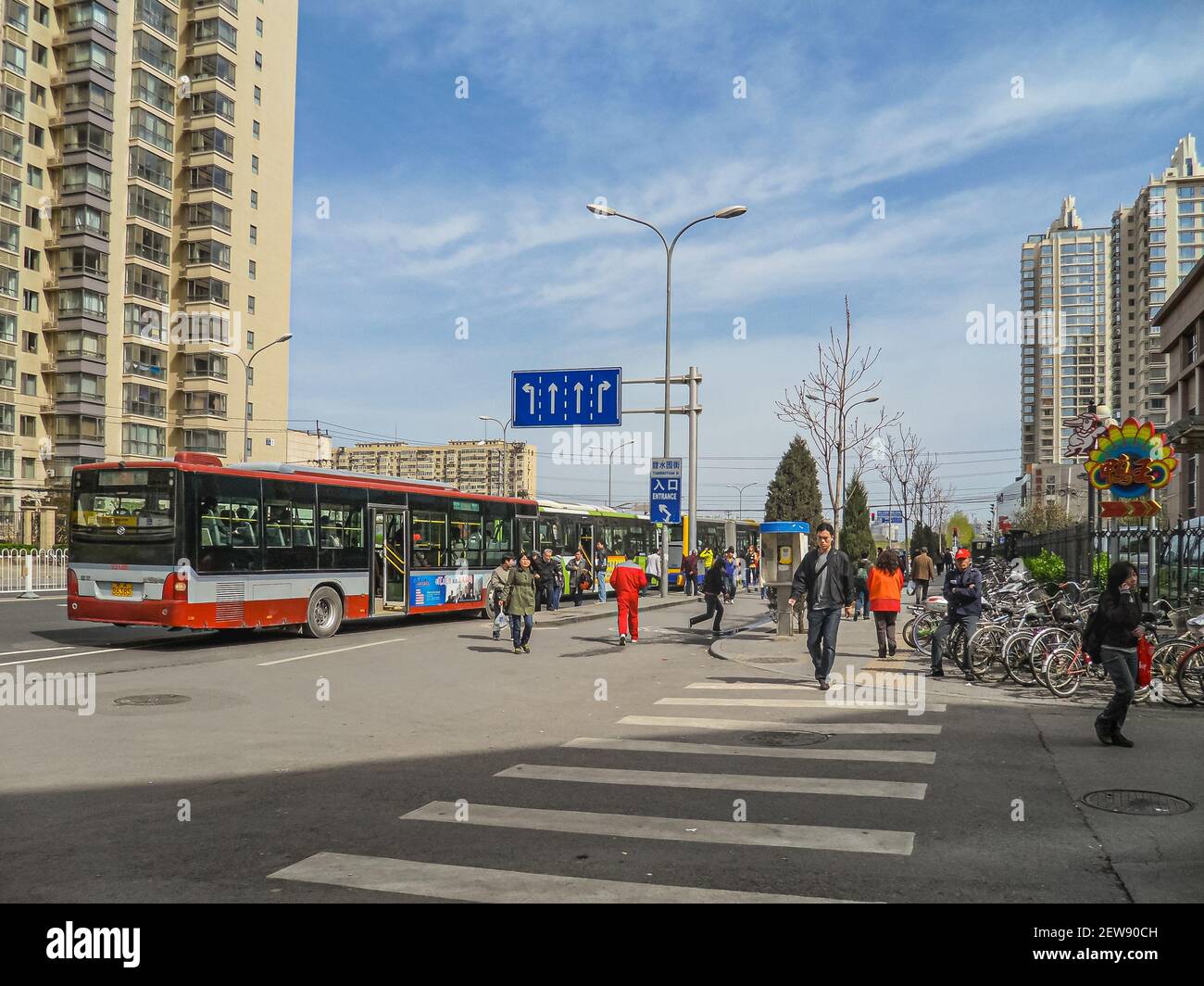 Beijing, China - April 25, 2010: Public transport buses stop on corner ...