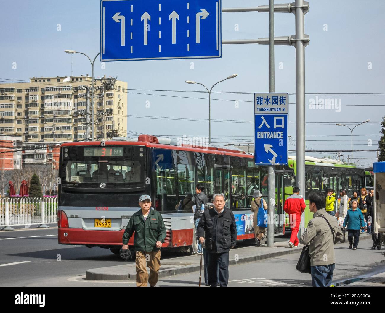 Beijing, China - April 25, 2010: Public buses stop on corner of ...