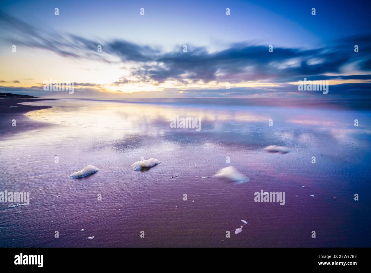 A reflection of wonderful sunset in water, Waddenzee, Texel, The ...