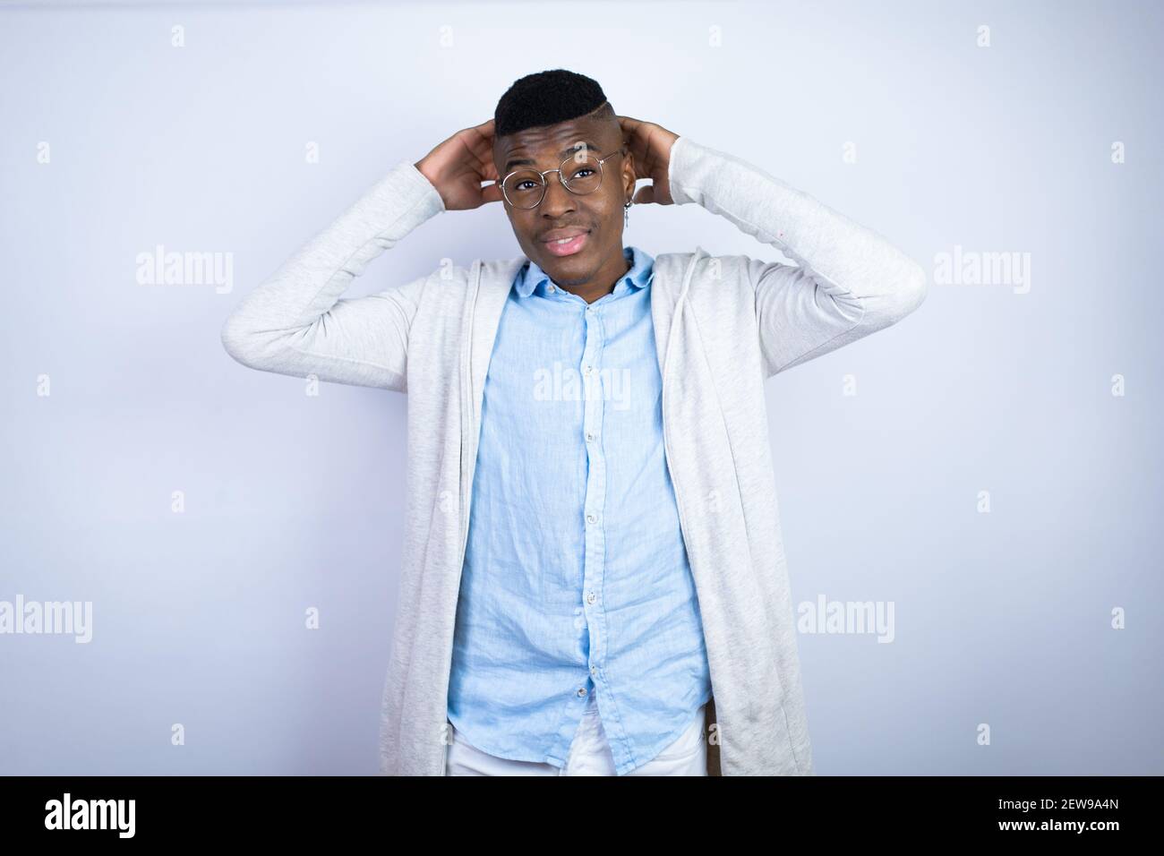 Male model arms behind head hi-res stock photography and images - Alamy