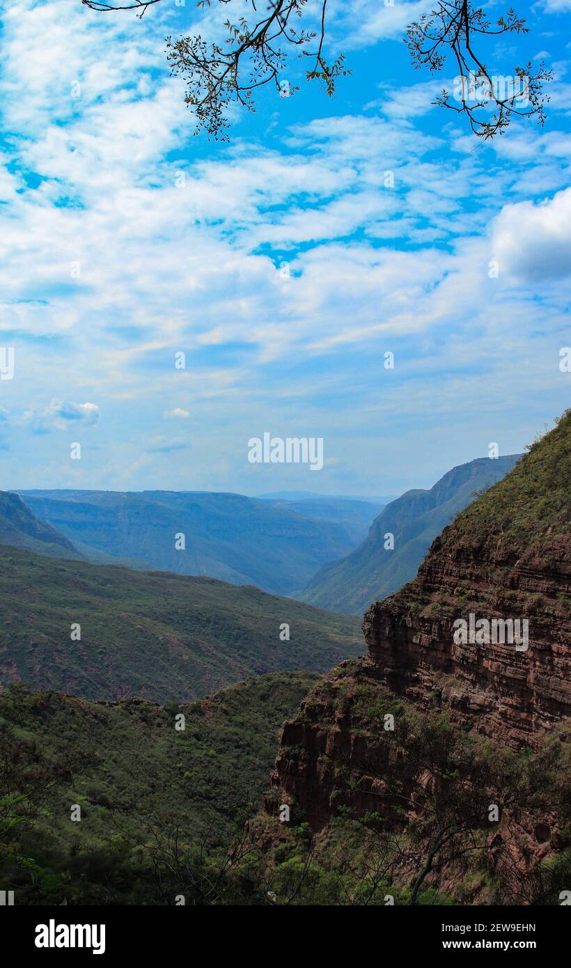 Vertical shot of a landscape with rocks mountains and plants Stock ...
