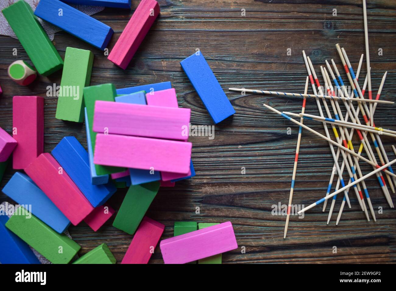 A top view of rectangular colorful wooden blocks and Mikado pick-up ...