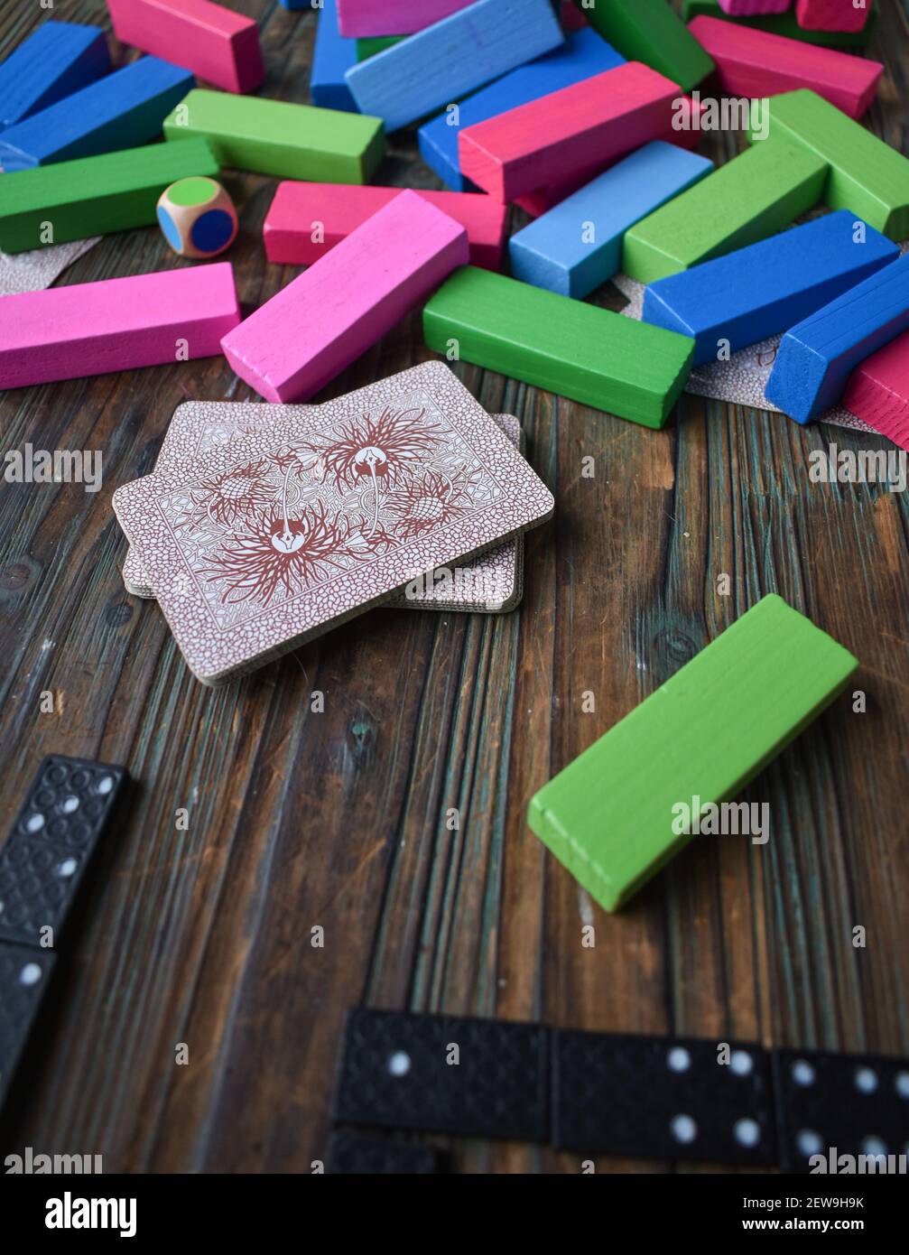 The playing cards and rectangular colorful wooden blocks scattered on ...
