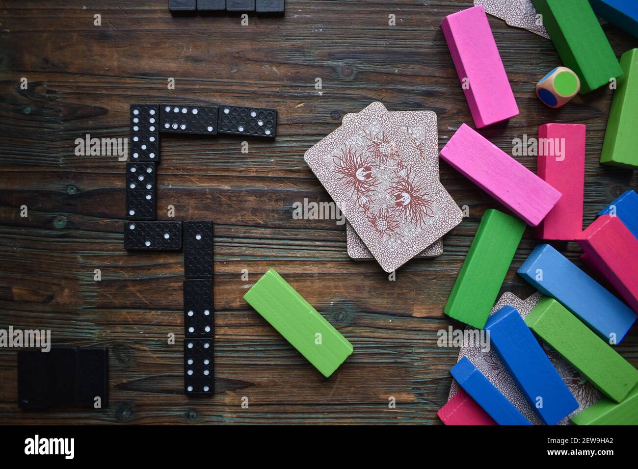 A top view of playing cards, rectangular colorful wooden blocks, and ...
