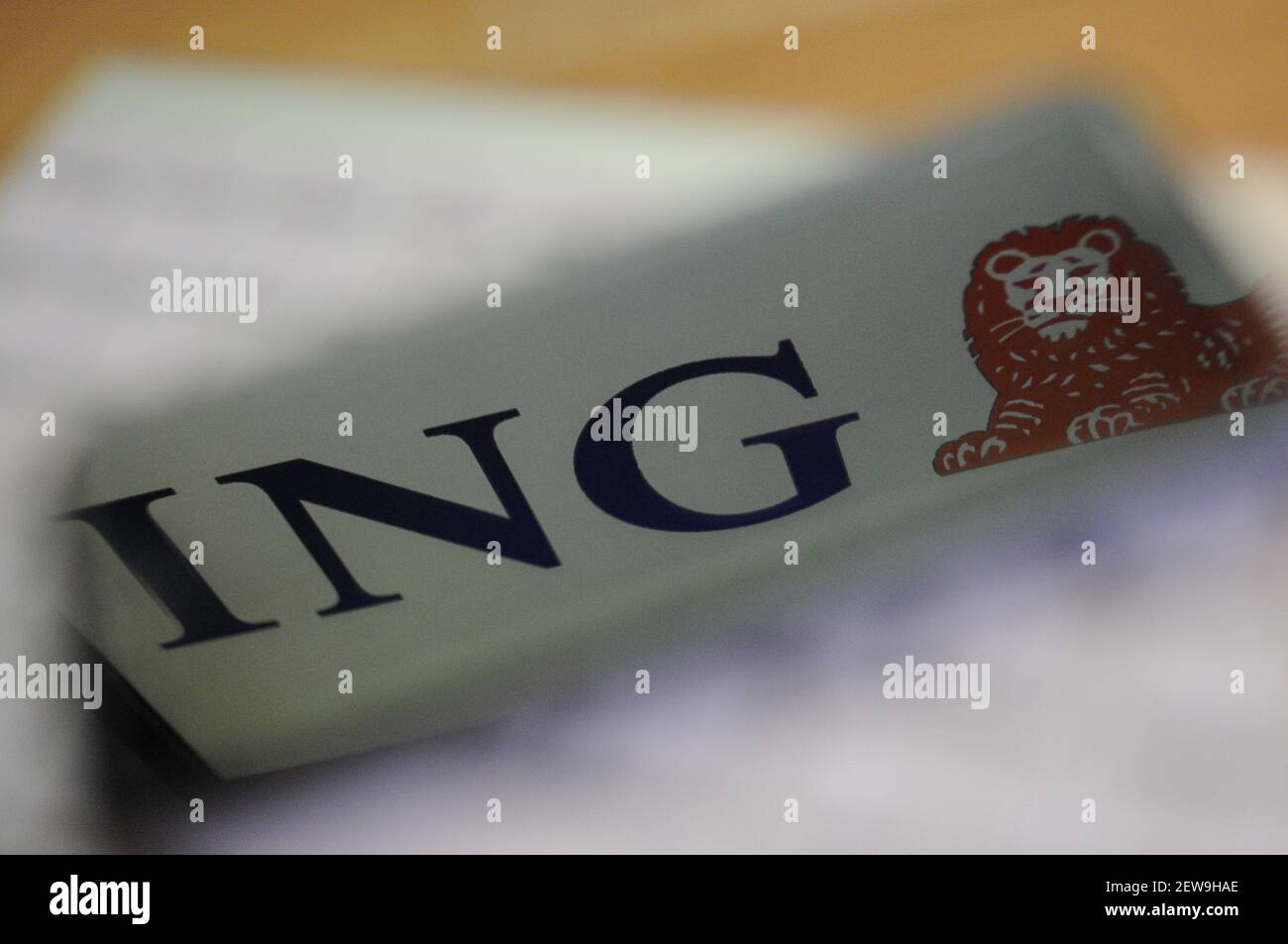 The ING bank logo is seen reflected on the screen of a mobile phone in ...