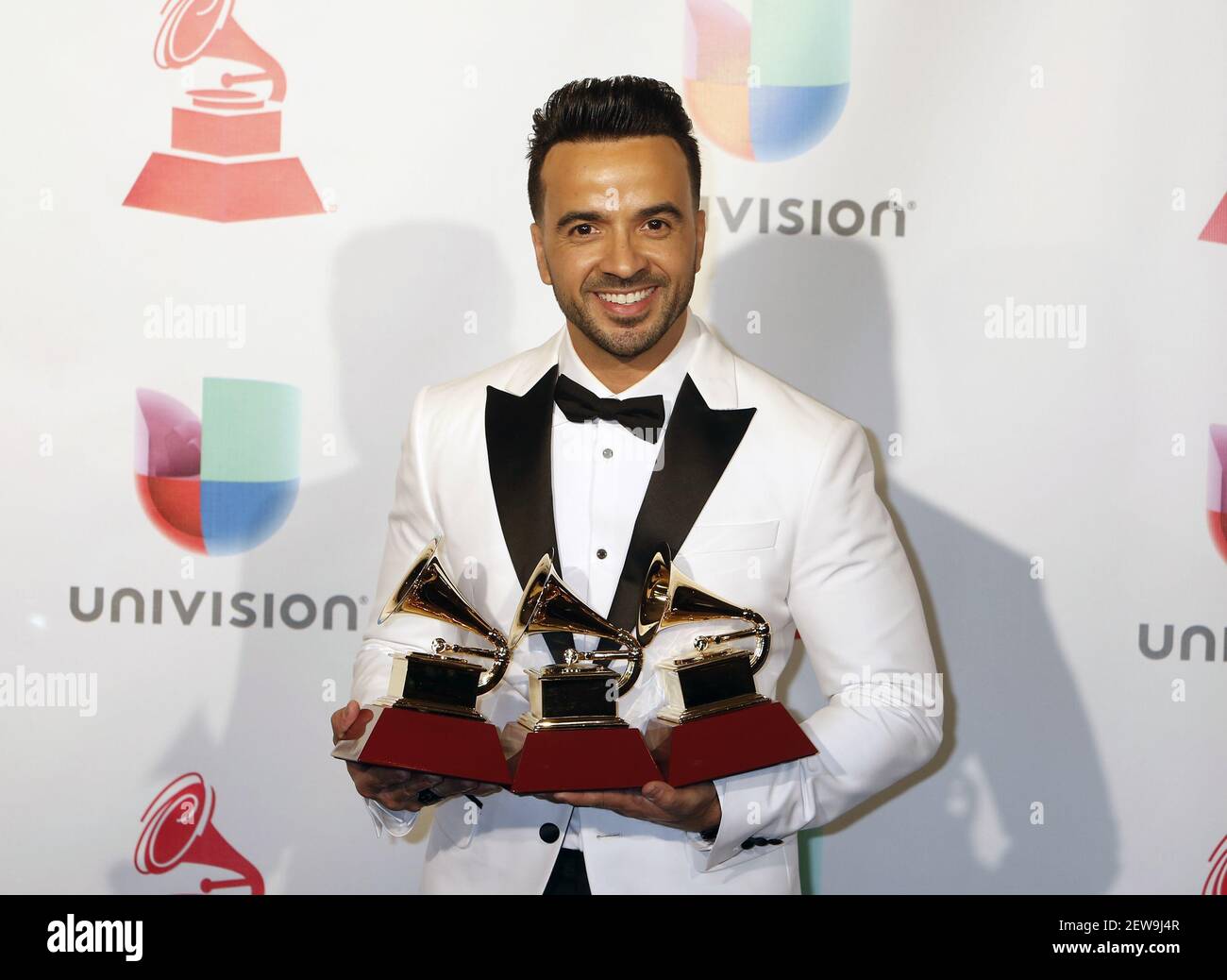Luis Fonsi poses for photo with his Record Of the Year, Best Urban ...