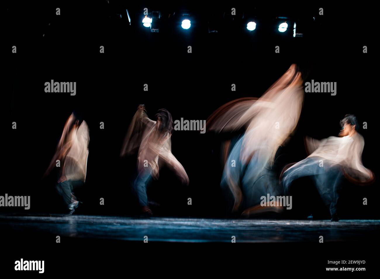 An abstract image of hip-hop dancers performing on a stage Stock Photo ...