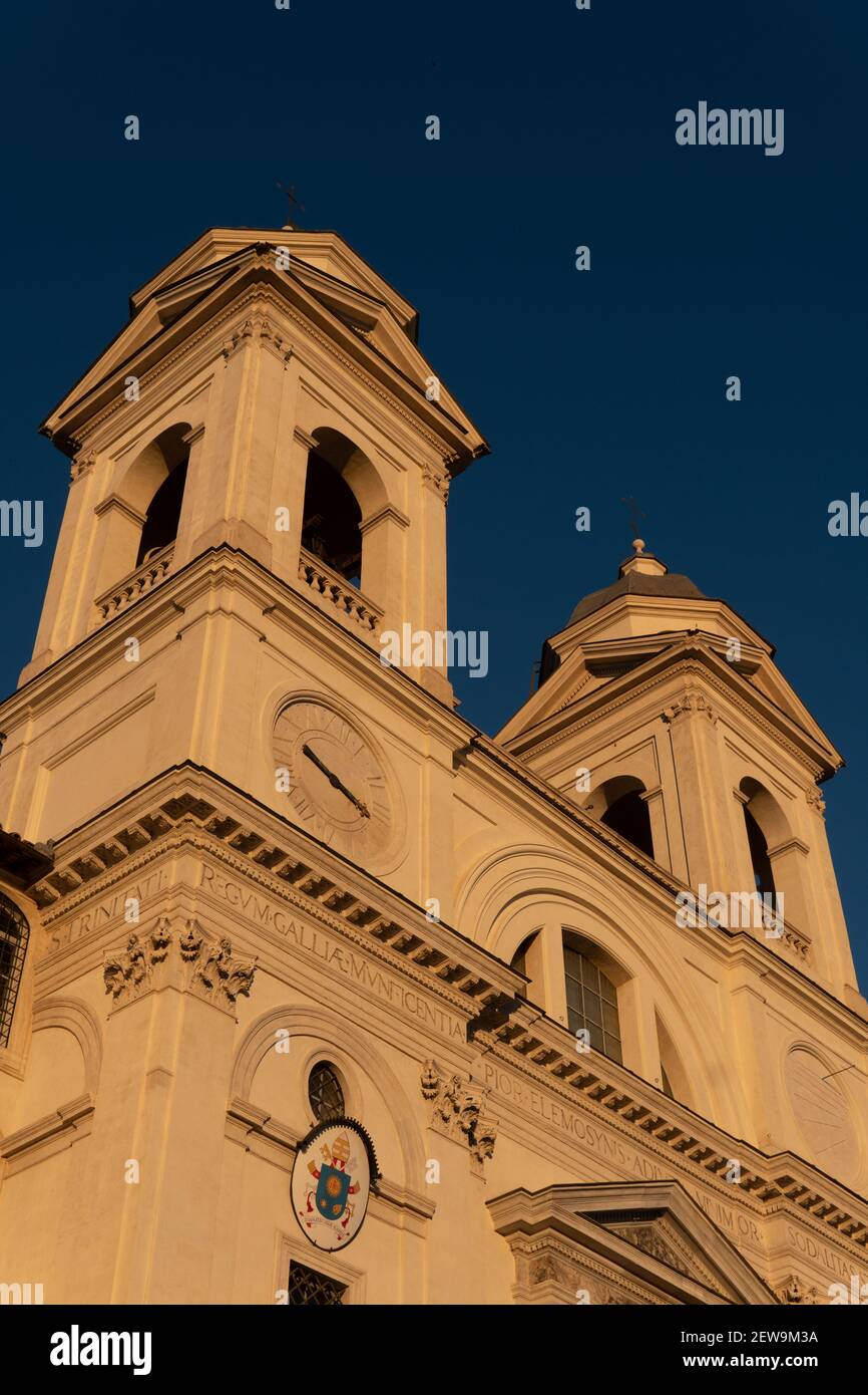 The facade of a beige building with two towers designed with modern ...