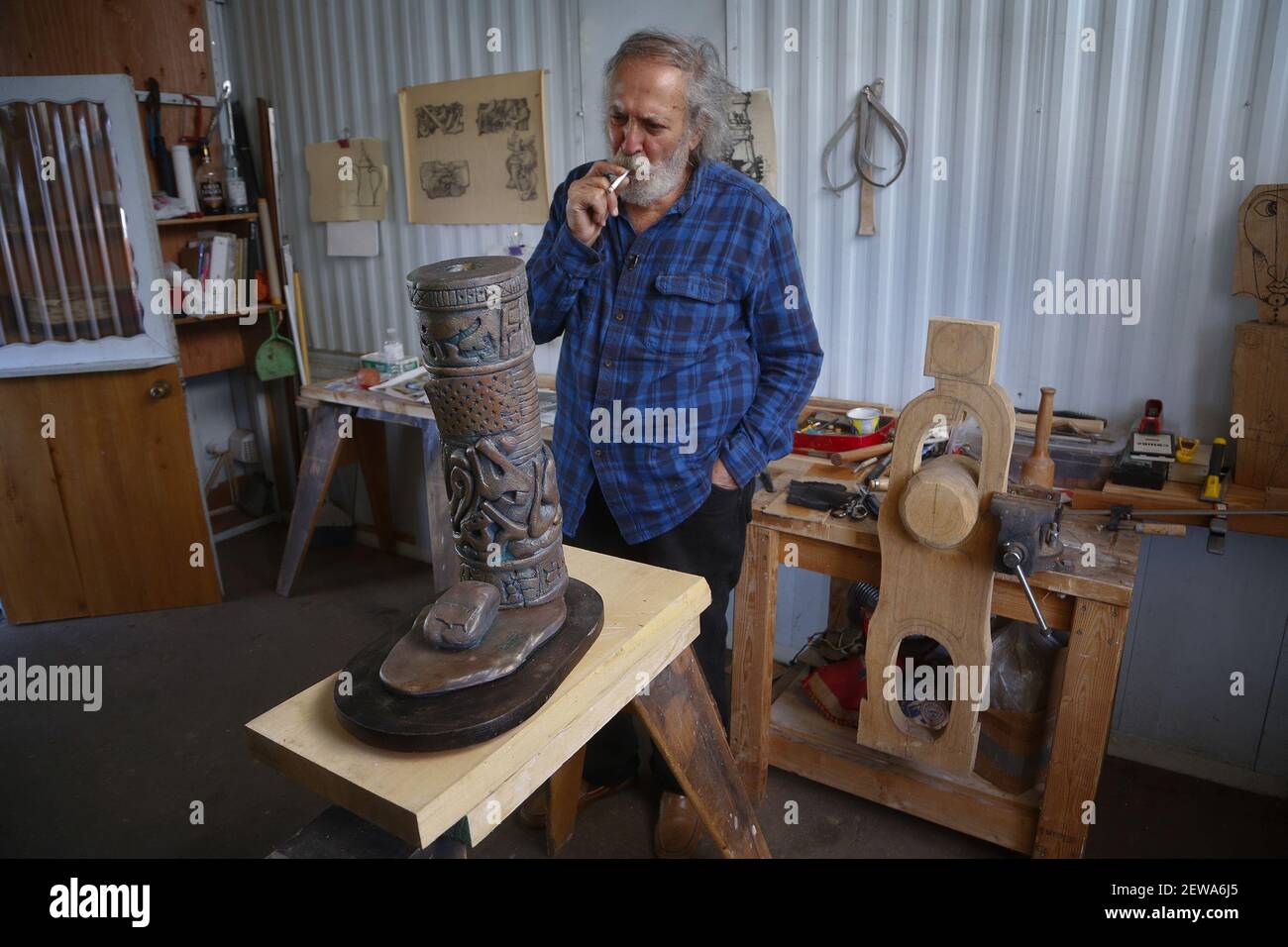 At his studio in El Cajon, Alaa Al Saffar looks over a scaled model of ...