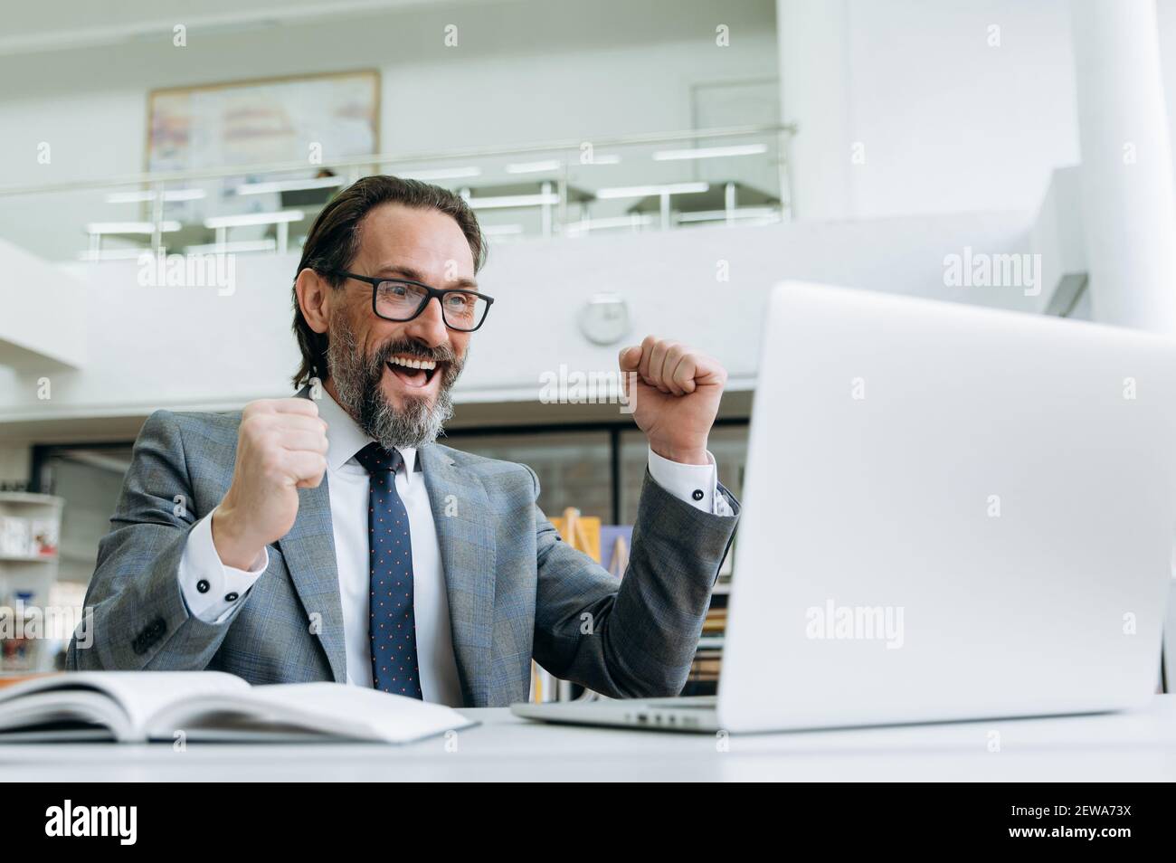 Joyful senior businessman got job promotion or a good deal. Successful ...