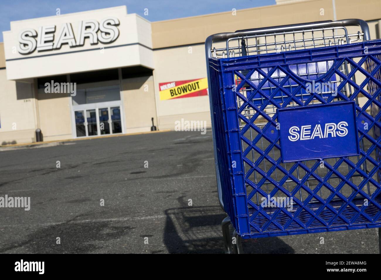 A logo sign outside of a Sears retail store in Alexandria, Virginia on ...