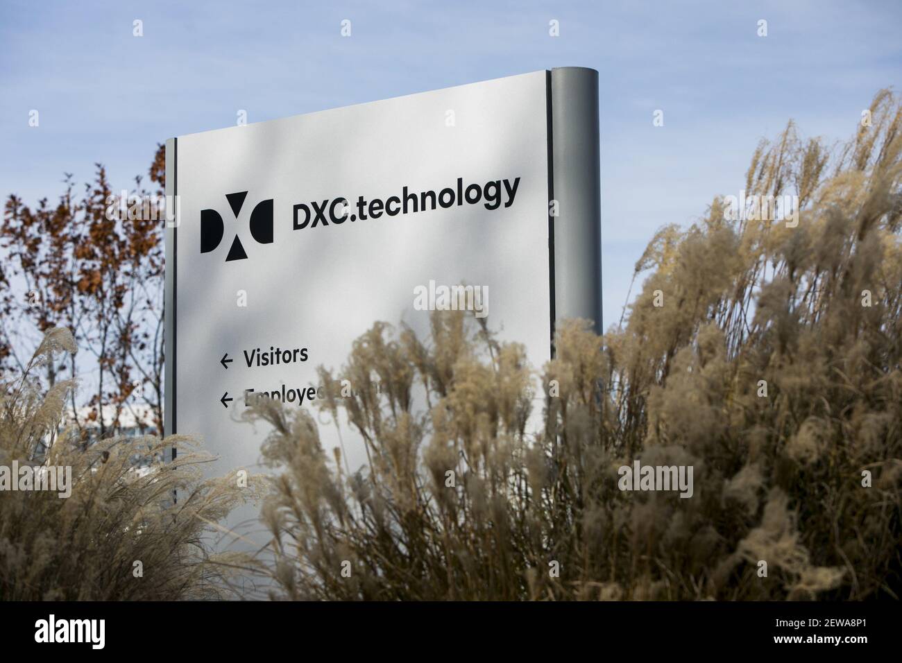 A logo sign outside of a facility occupied by DXC Technology in ...