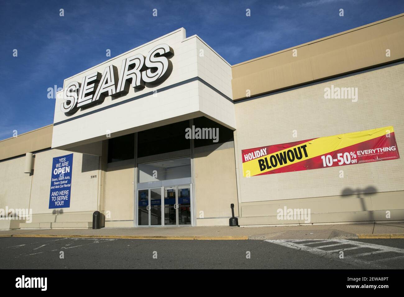 A logo sign outside of a Sears retail store in Alexandria, Virginia on ...