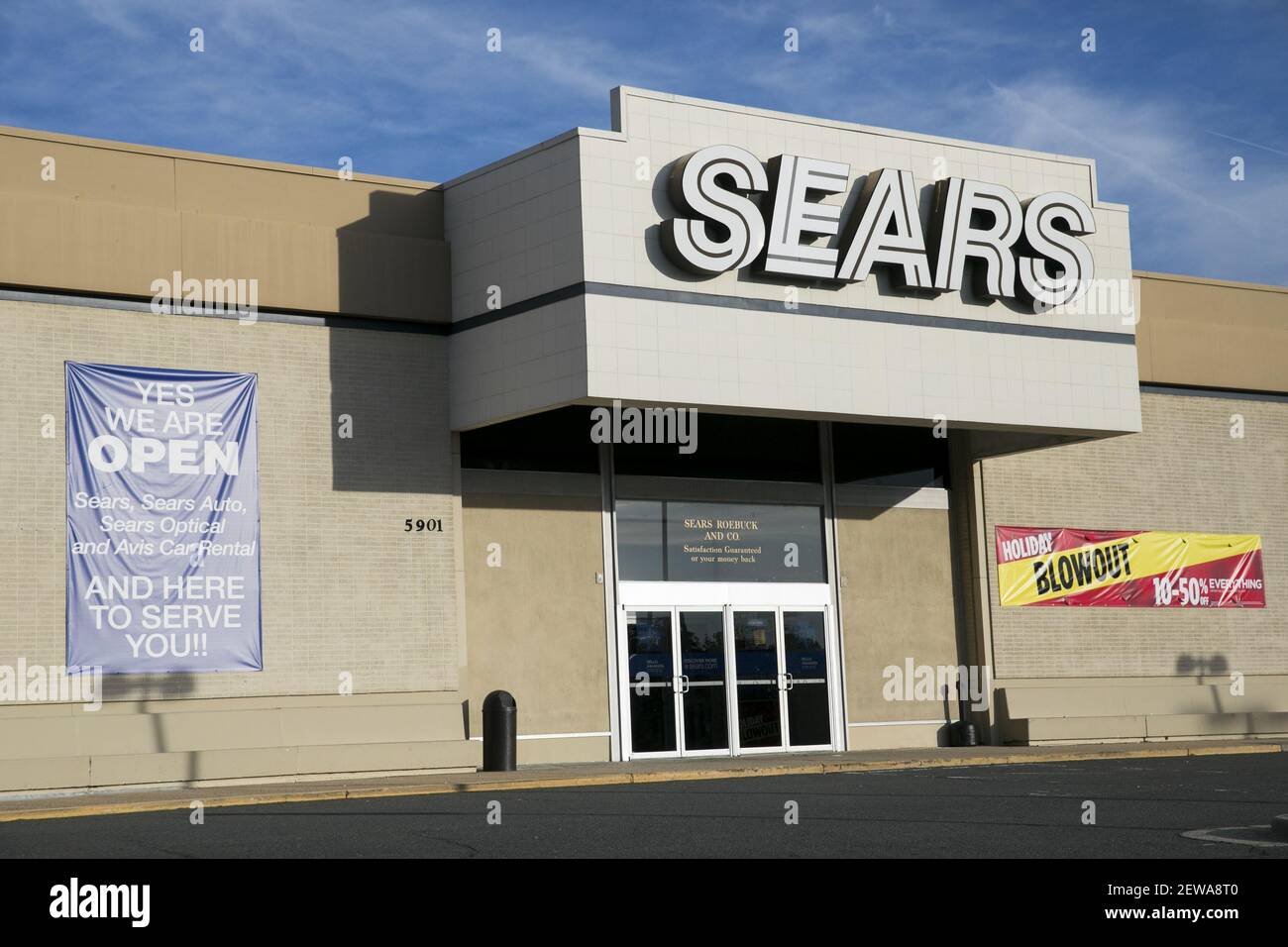 A logo sign outside of a Sears retail store in Alexandria, Virginia on ...