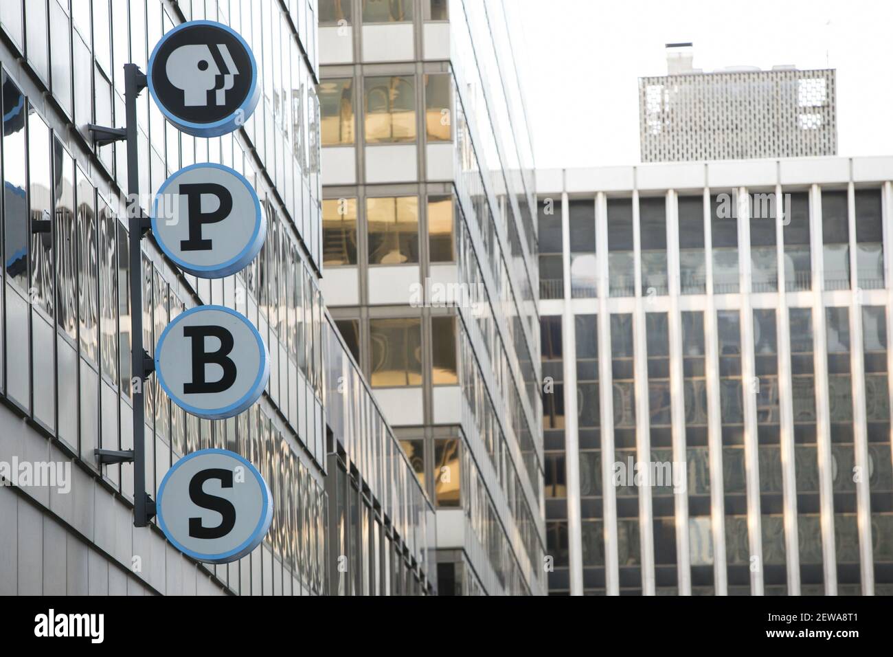A logo sign outside of the headquarters of The Public Broadcasting ...