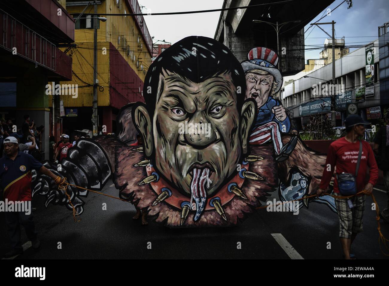 Protesters pull an effigy of Philippine President Rodrigo Duterte and ...