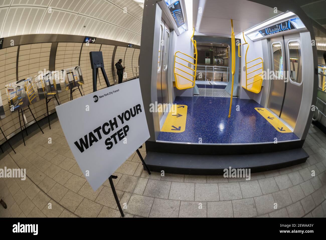 Commuters, media and subway aficionados inspect the mock-ups of the ...