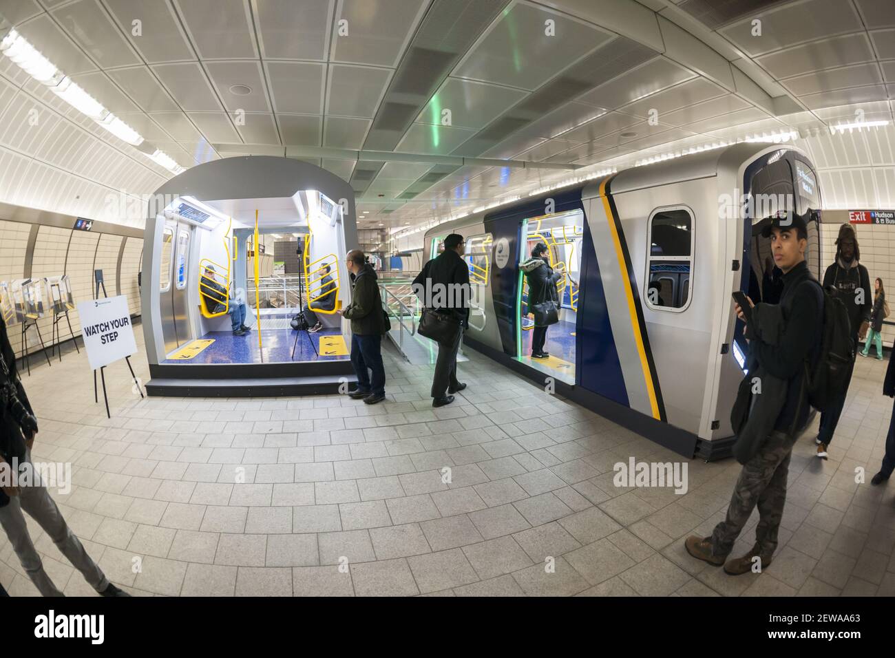 Commuters, media and subway aficionados inspect the mock-ups of the ...