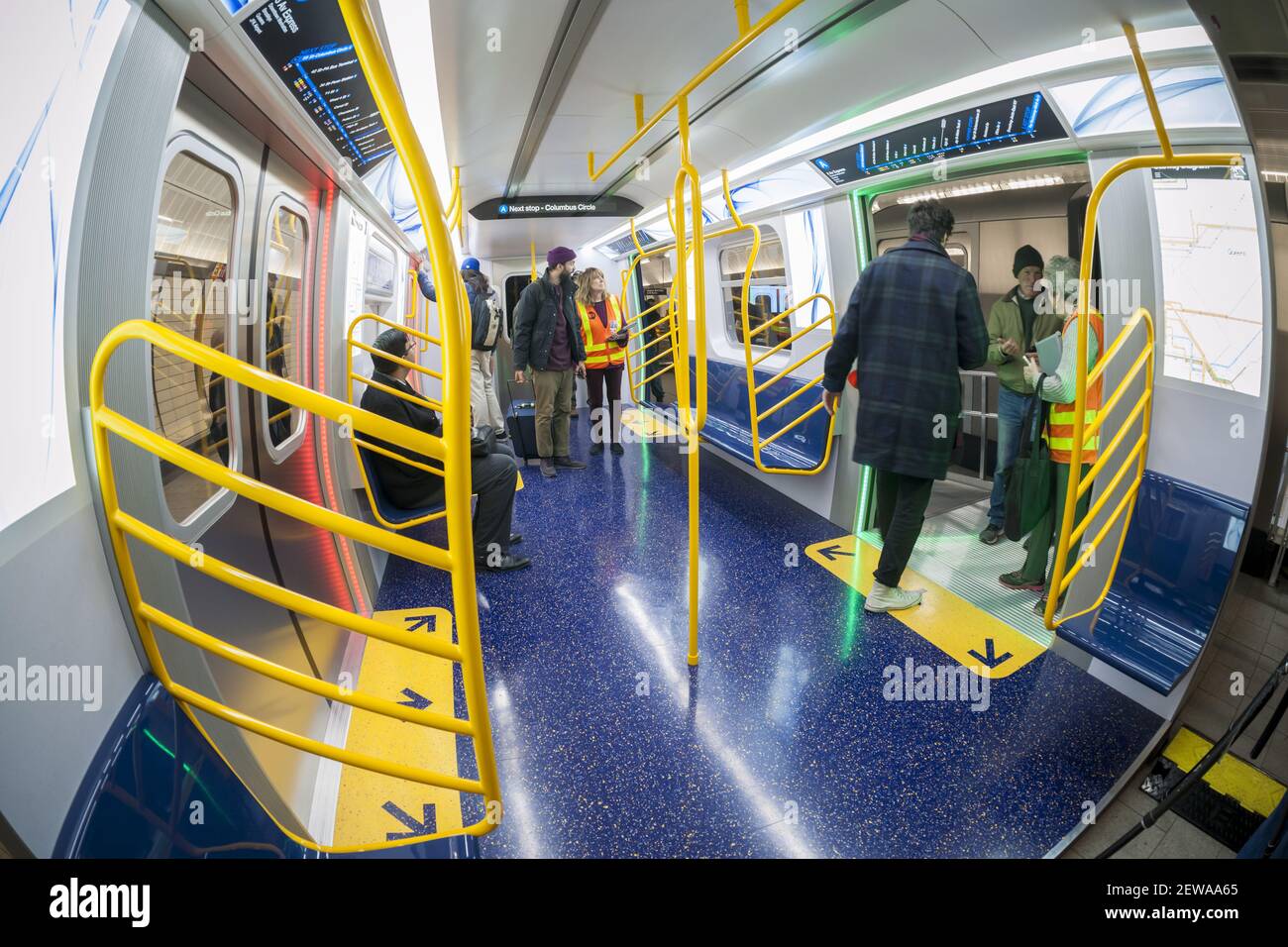 Commuters, media and subway aficionados inspect the mock-ups of the ...