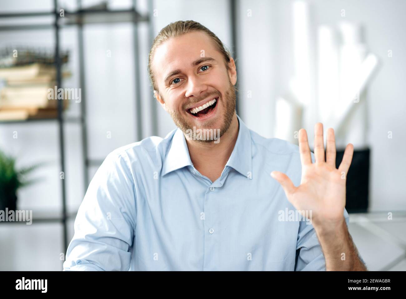 Waving hand to colleagues hi-res stock photography and images - Alamy