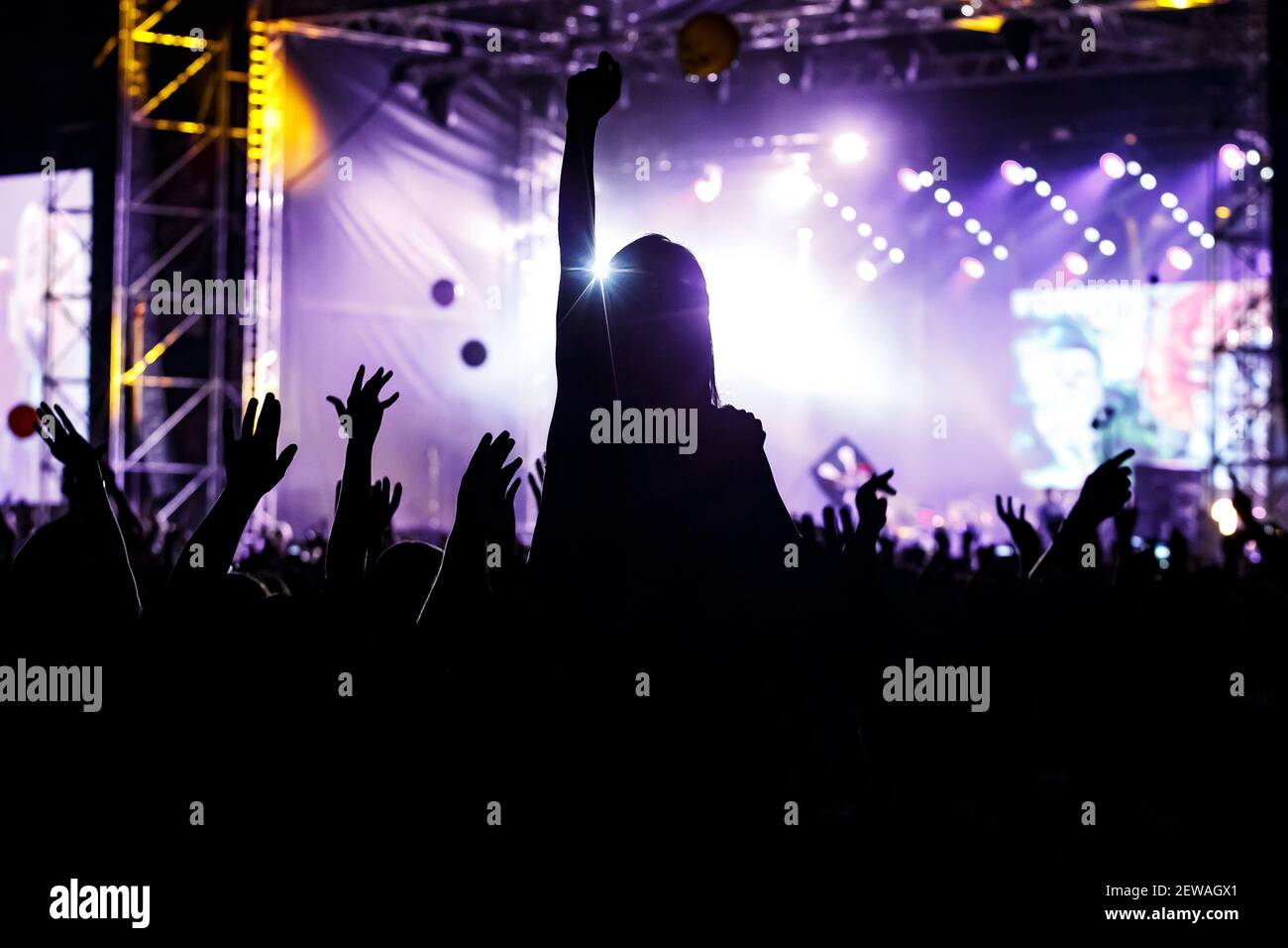 Girl silhouette on a big concert show Stock Photo - Alamy