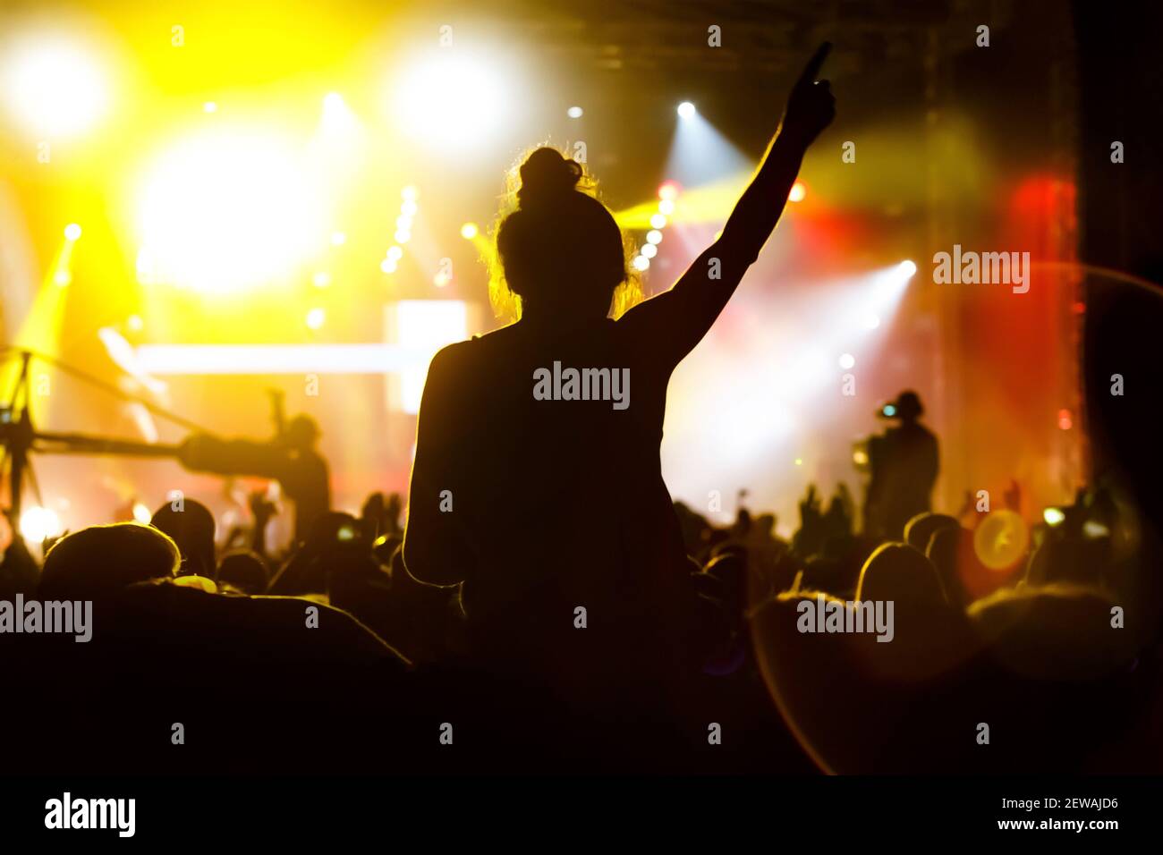Girl silhouette on a big concert show Stock Photo - Alamy