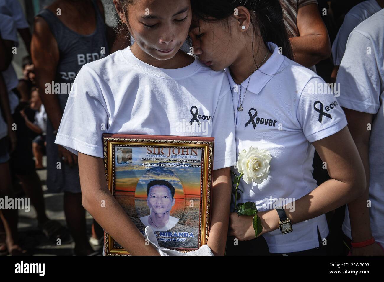 The daughters of Leover Miranda, who was killed by police in an anti ...