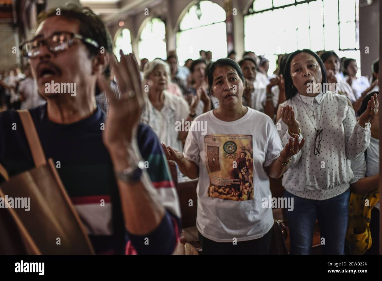 Mourners take part in a mass during the funeral of activist priest Fr ...