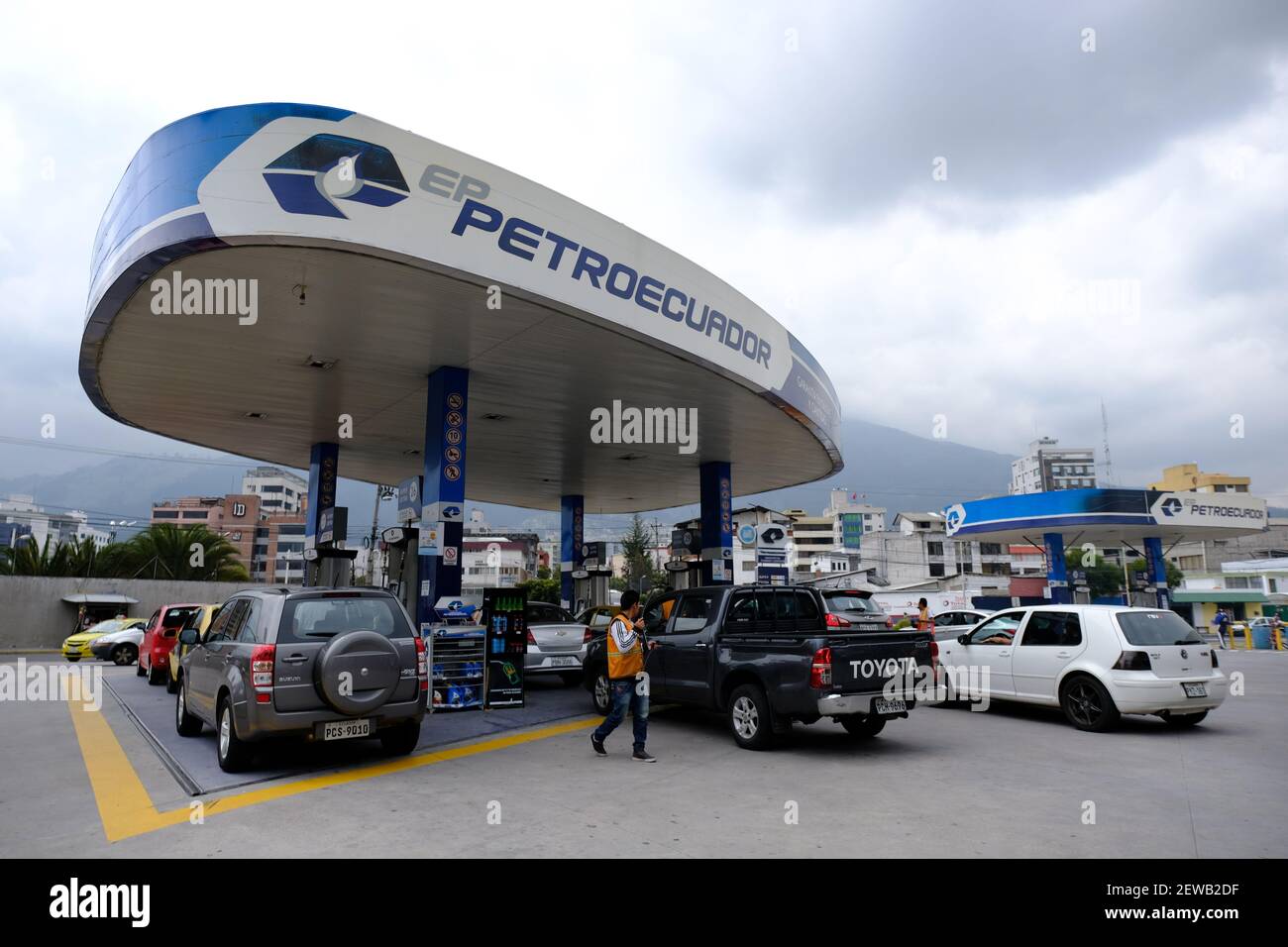 Cars fill up an an EP Petroecuador gas station in Quito, Ecuador, on ...