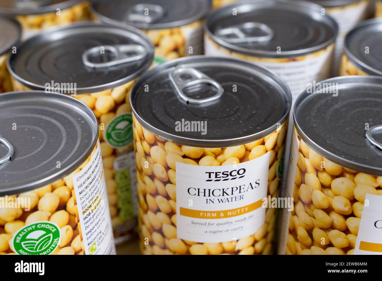 dozen Tins of Tesco Chickpeas layout on flat surface Stock Photo - Alamy