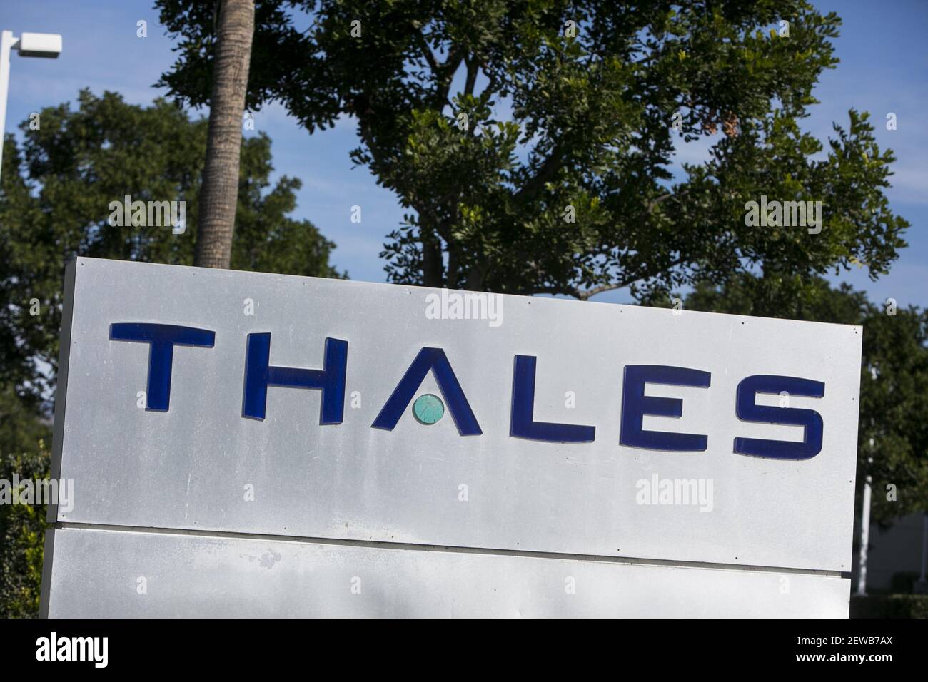 A logo sign outside of a facility occupied by the Thales Group in ...