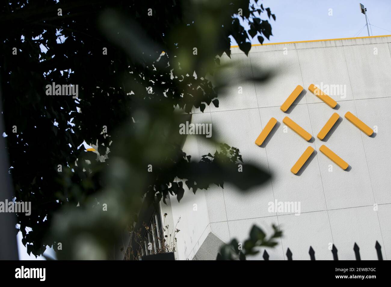 A logo sign outside of the headquarters of Faraday Future in Gardena ...
