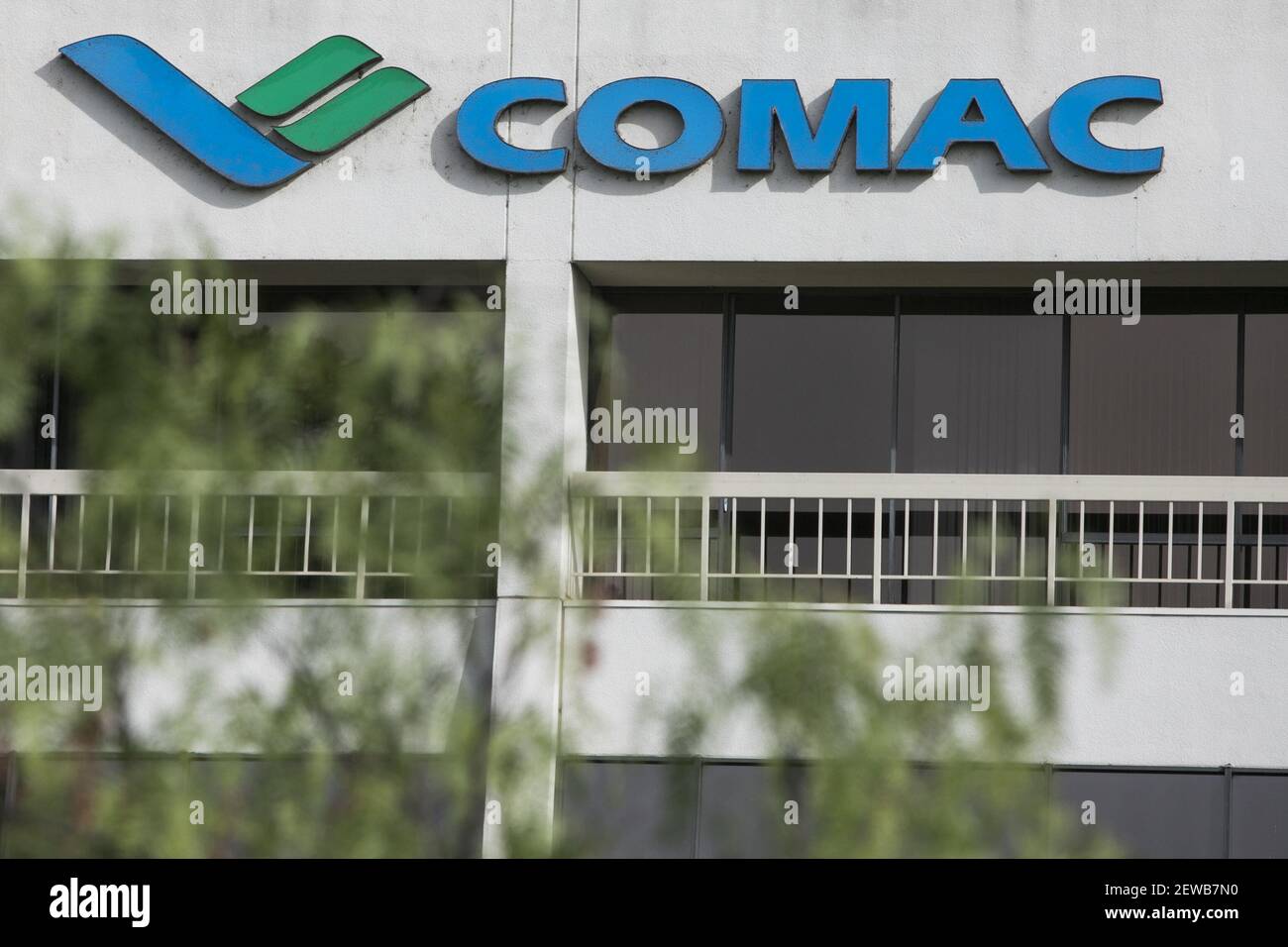 A logo sign outside of a facility occupied by The Commercial Aircraft ...