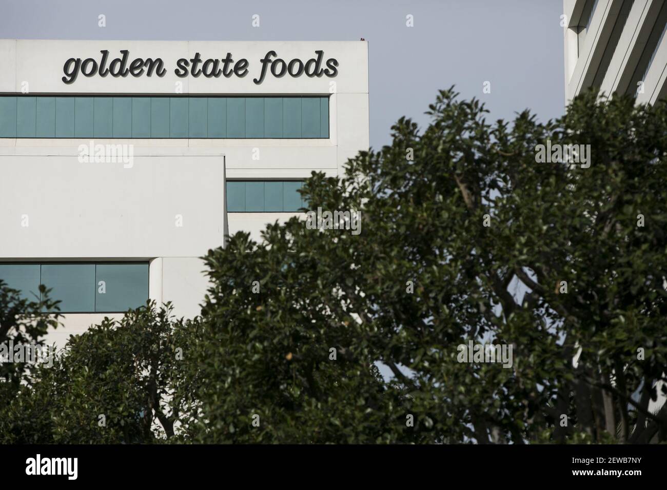 A logo sign outside of the headquarters of Golden State Foods in Irvine ...