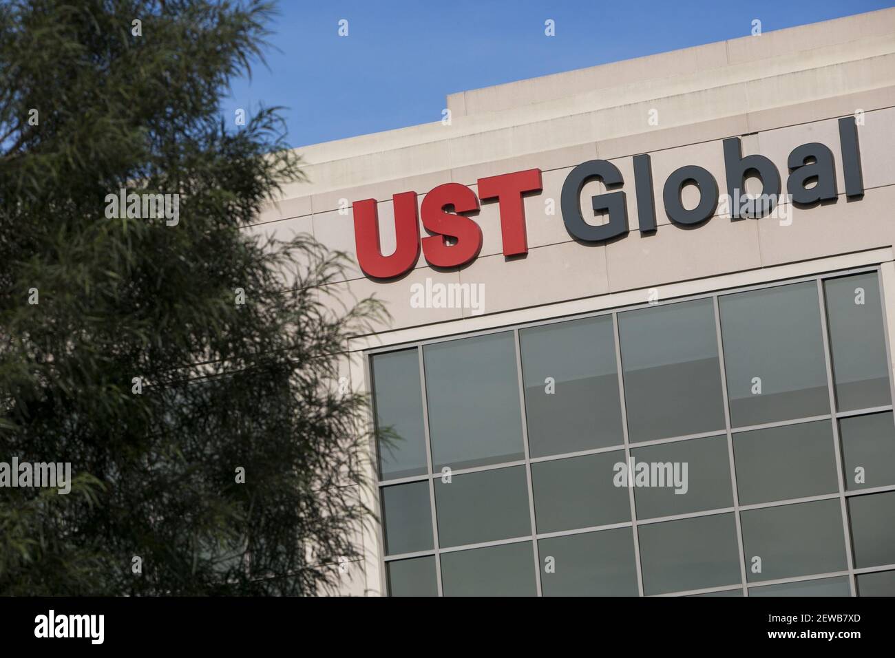 A logo sign outside of the headquarters of UST Global in Aliso Viejo ...