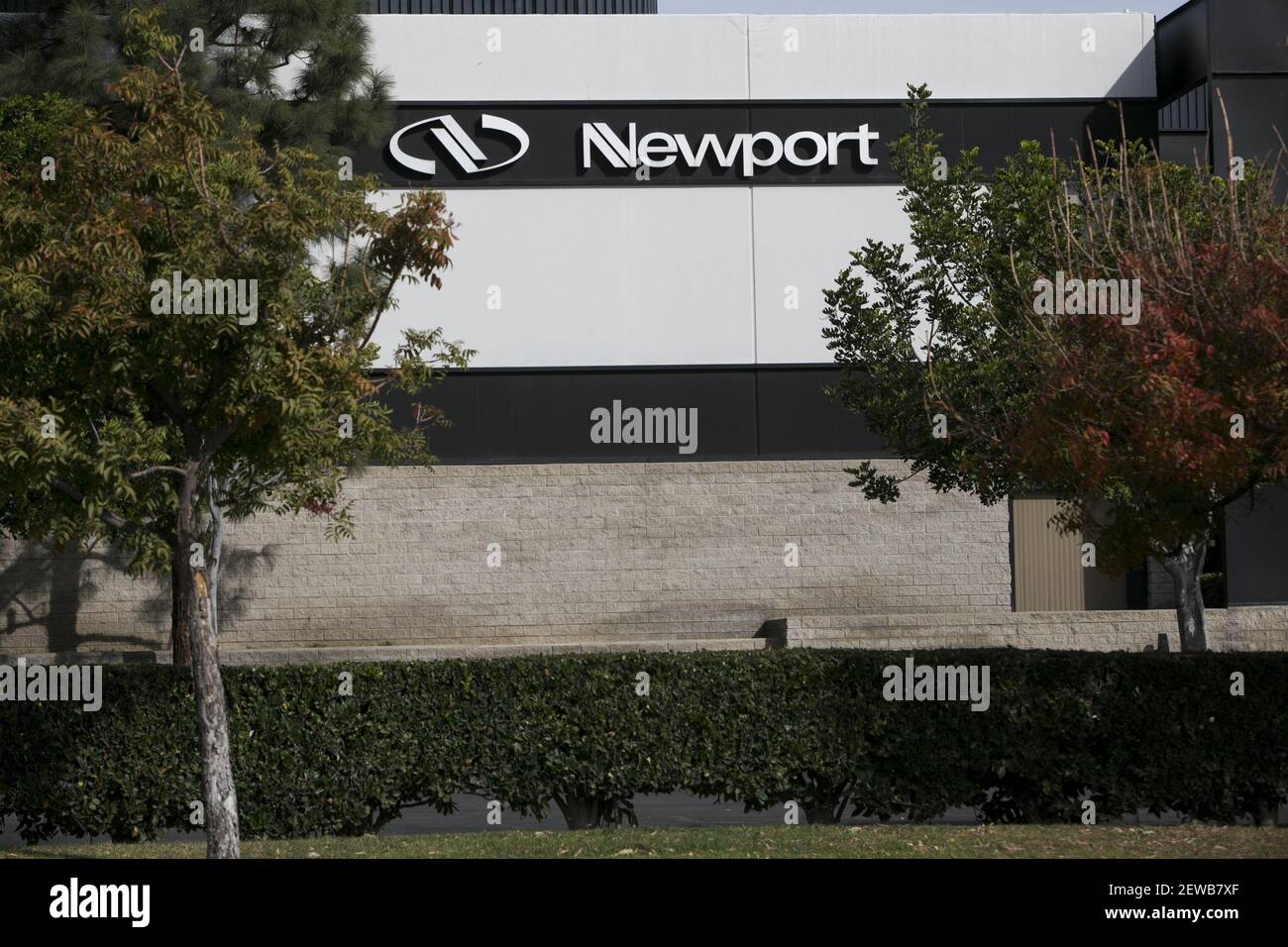 A logo sign outside of the headquarters of the Newport Corporation in ...