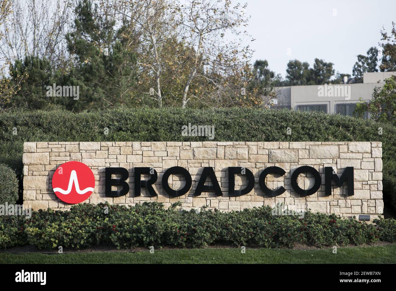 A logo sign outside of the headquarters of the Broadcom Corporation in ...