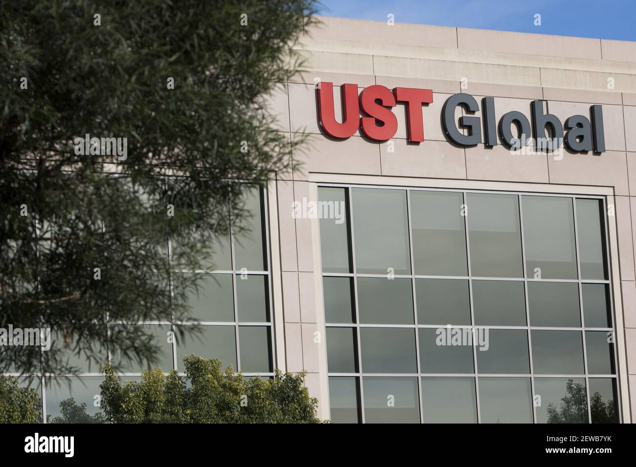 A logo sign outside of the headquarters of UST Global in Aliso Viejo ...