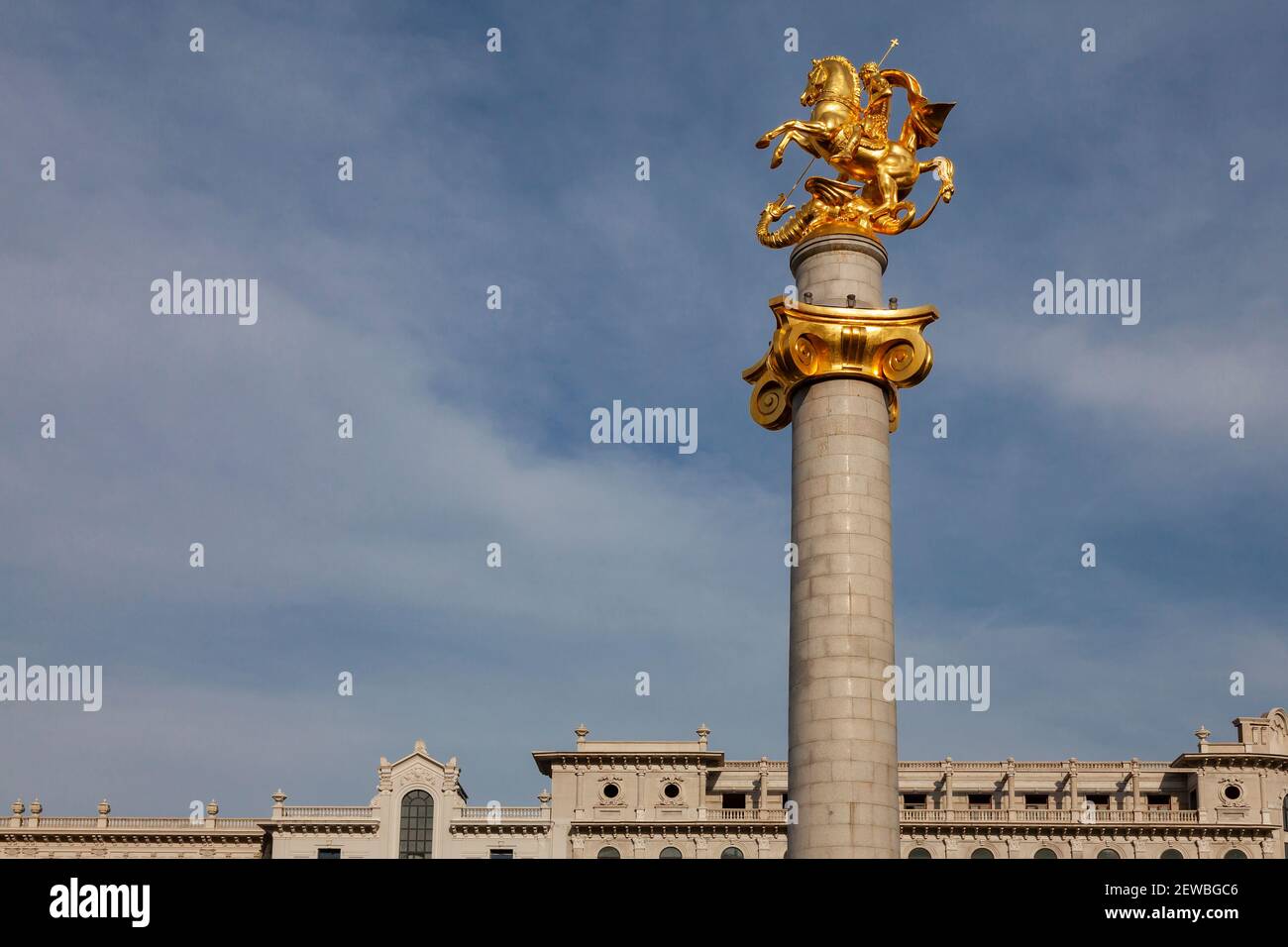 The statue of gold is at the top of the high column Stock Photo - Alamy