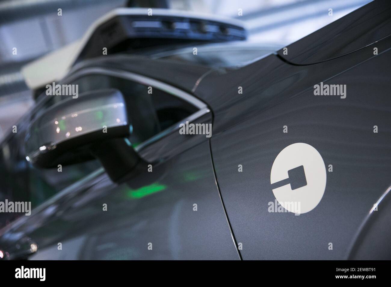 An Uber logo on a Uber Technologies Inc., self-driving autonomous Volvo ...