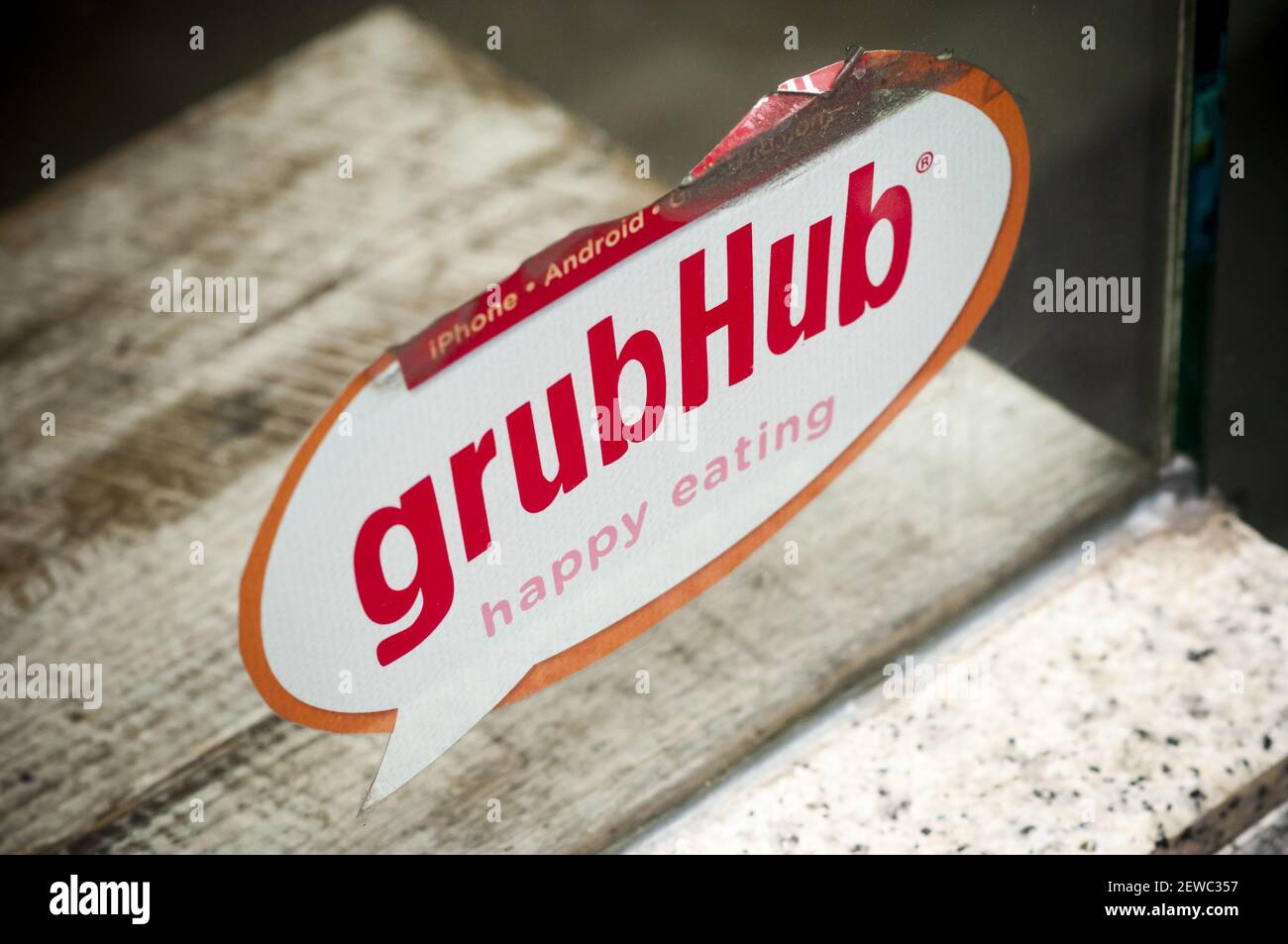 A worn sticker for the GrubHub internet food delivery service is seen ...