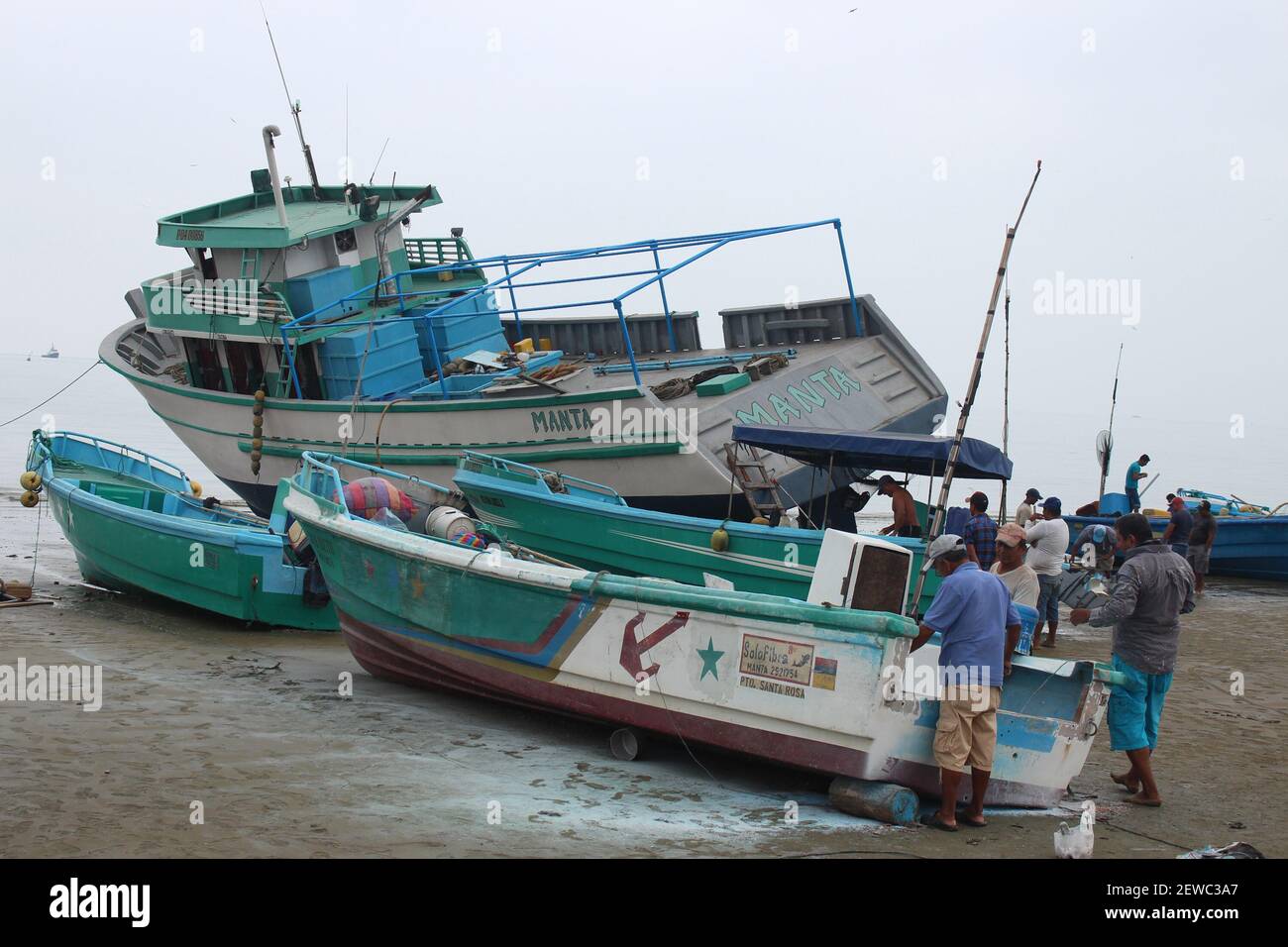 A longliner, the Manta, gets maintenance on Playita Mia, a beach on the ...