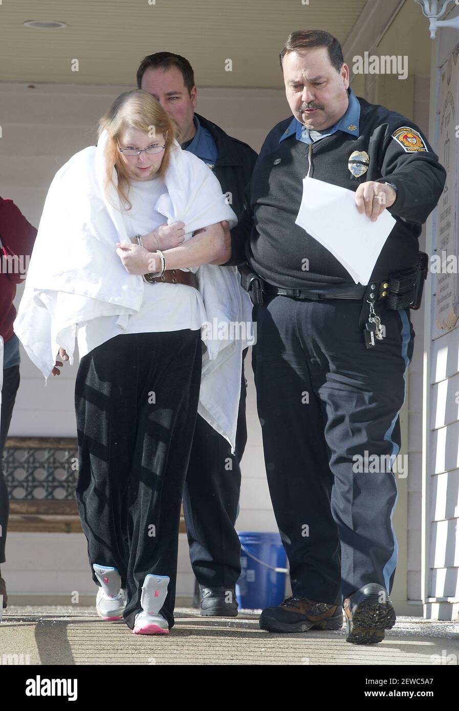 Constables escort Sara Packer out of the courtroom of District Judge ...