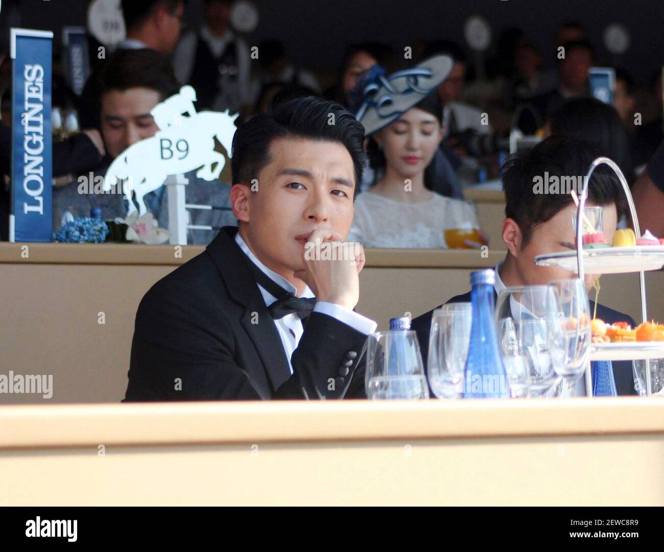 --FILE--Chinese actor Sun Yizhou, also known as Sean Sun, shows off ...