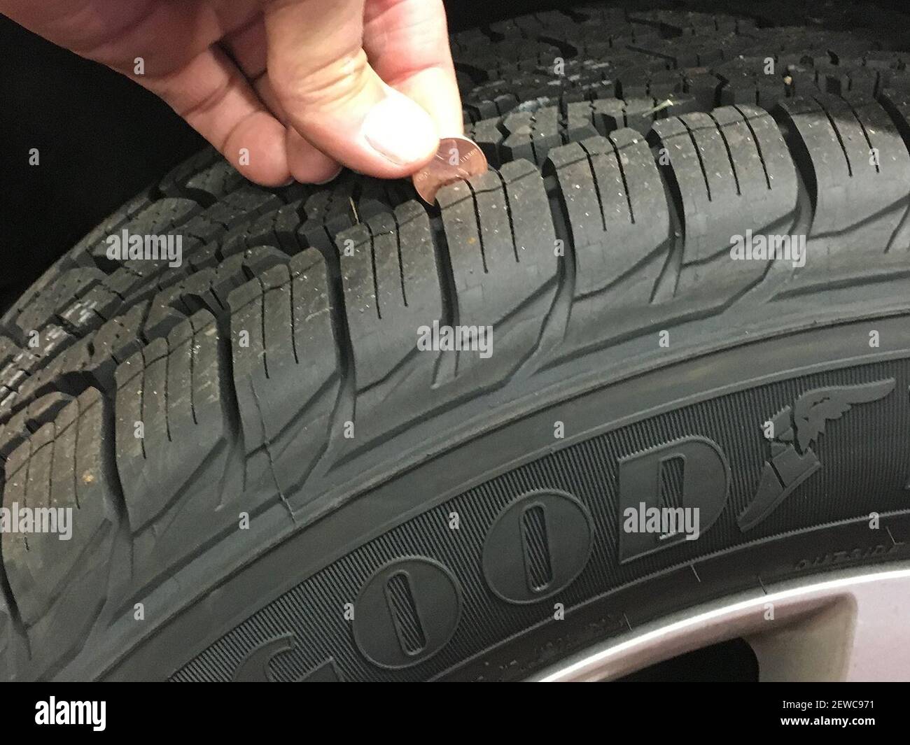 Jeff Hermsen, store manager of Just Tires in Deerfield, Ill., checks ...