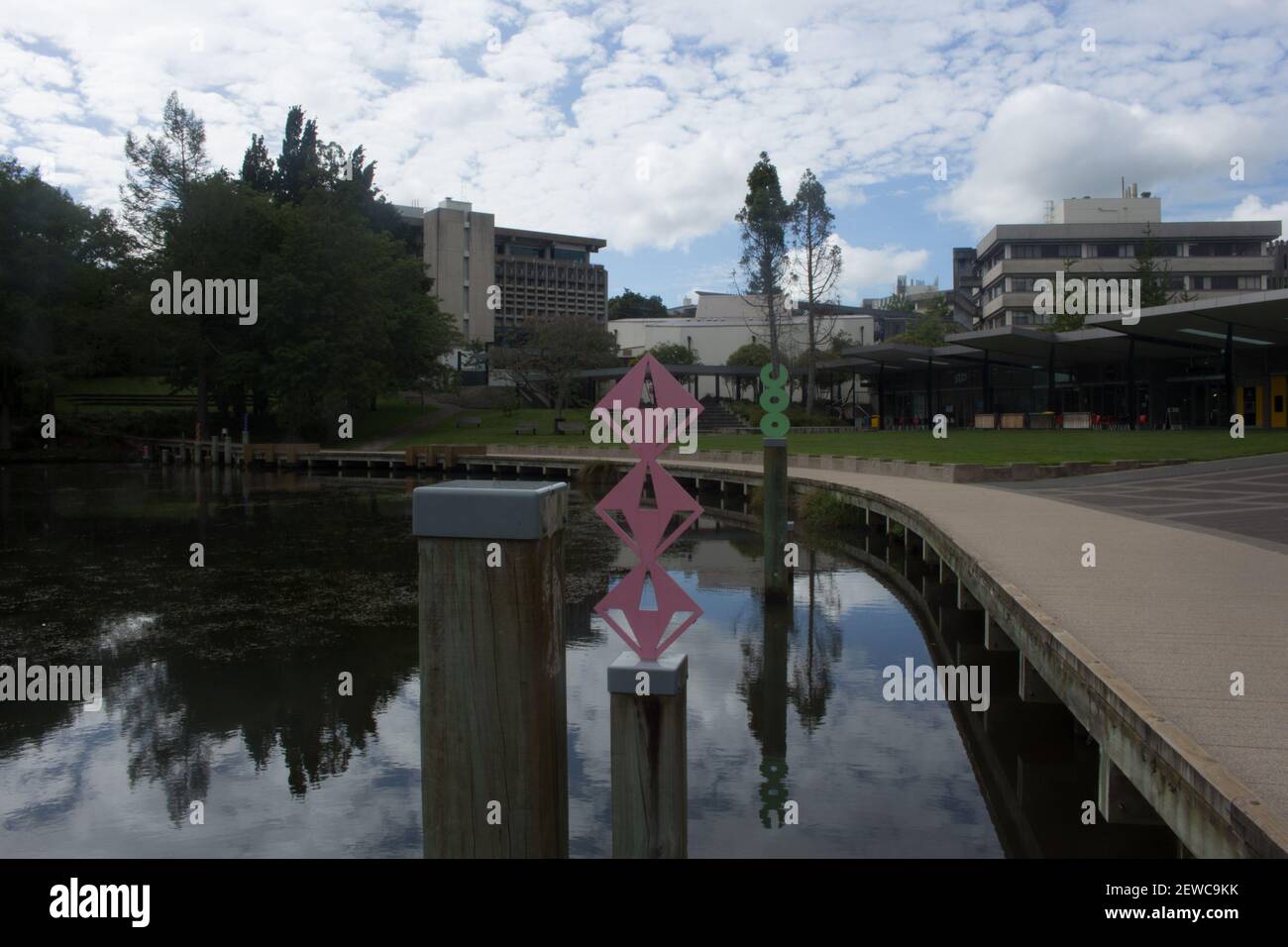 Pond and campus buildings are visible at the University of Waikato in ...