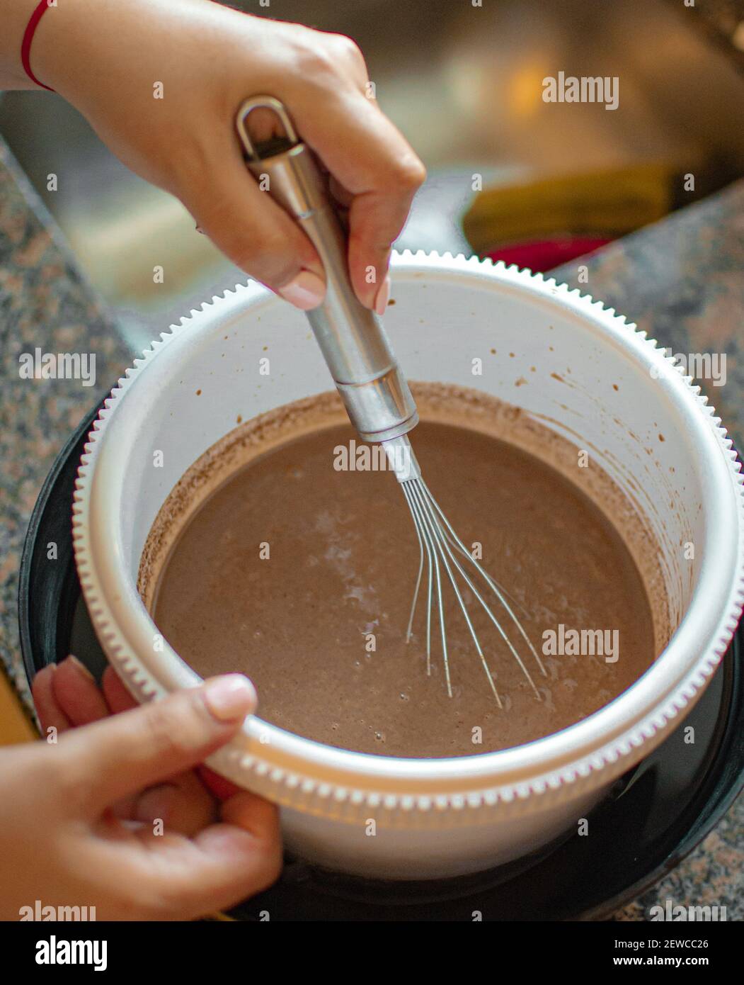 A female mixing and preparing chocolate cream Stock Photo - Alamy